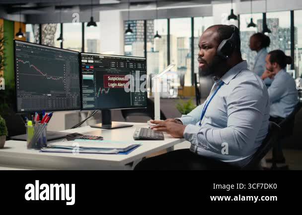 Stressed trader at work investigating suspicious access on trading ...