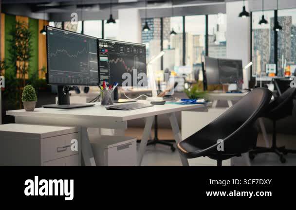 Trading software in proprietary firm office with candlestick graphs on ...