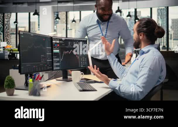 Happy coworkers in office doing high five after successful trading ...