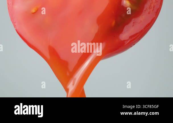 Natural Tomato Juice Streaming Over Ripe Tomato Half Stock Video ...