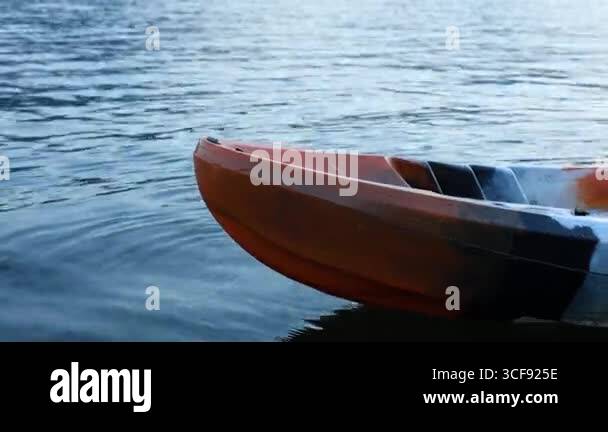 An empty boat floats on a tranquil lake Stock Video Footage - Alamy