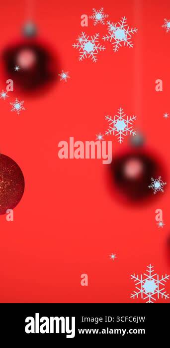 Animation of snow falling over christmas baubles. christmas, winter ...