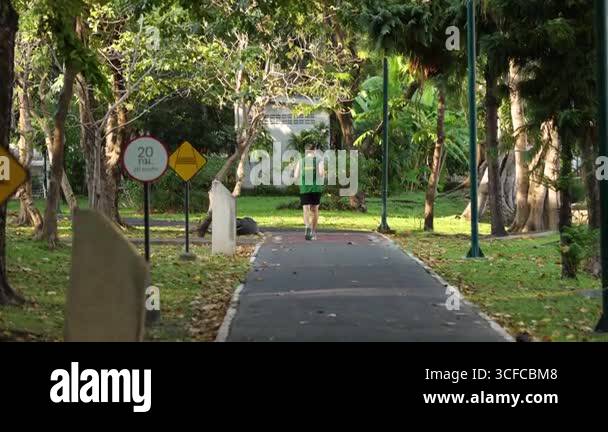 Runner jogging along pathway Stock Videos & Footage - HD and 4K Video ...