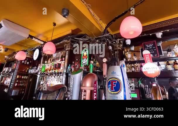 Bartender serving drinks in lively London pub Stock Video Footage - Alamy