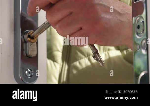 Hand unlocking door with key close up zoom shot selective focus Stock ...