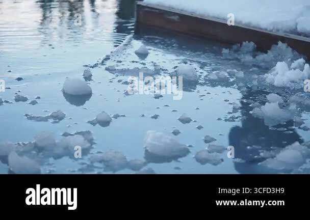 Ice chunks break apart as winter transitions to spring by the lake ...