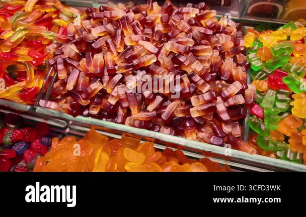 A vibrant display of gummy candies in various shapes and colors Stock ...