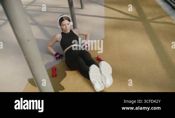 Woman in sportswear doing cross crunches abdominal exercise. Sport and ...