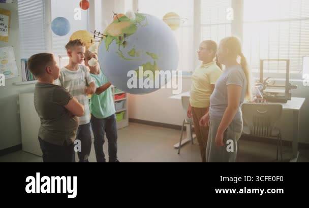 Environmental Science Lesson: Primary School Children Talking, Looking ...