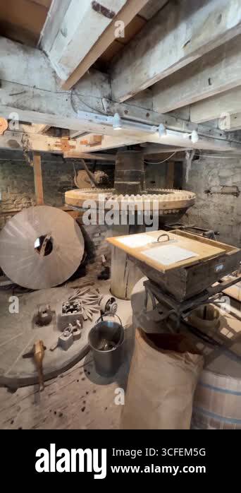 Interior and mechanism of an old wooden mill of the 18th century ...