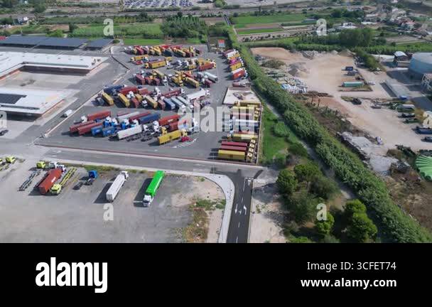 Parking of cargo container trucks. Aerial view of trucks carrying cargo ...