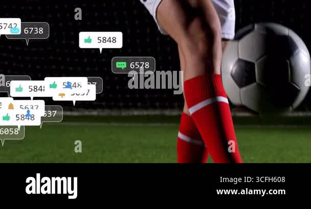 Soccer player tapping ball on turf raising floating social icons ...