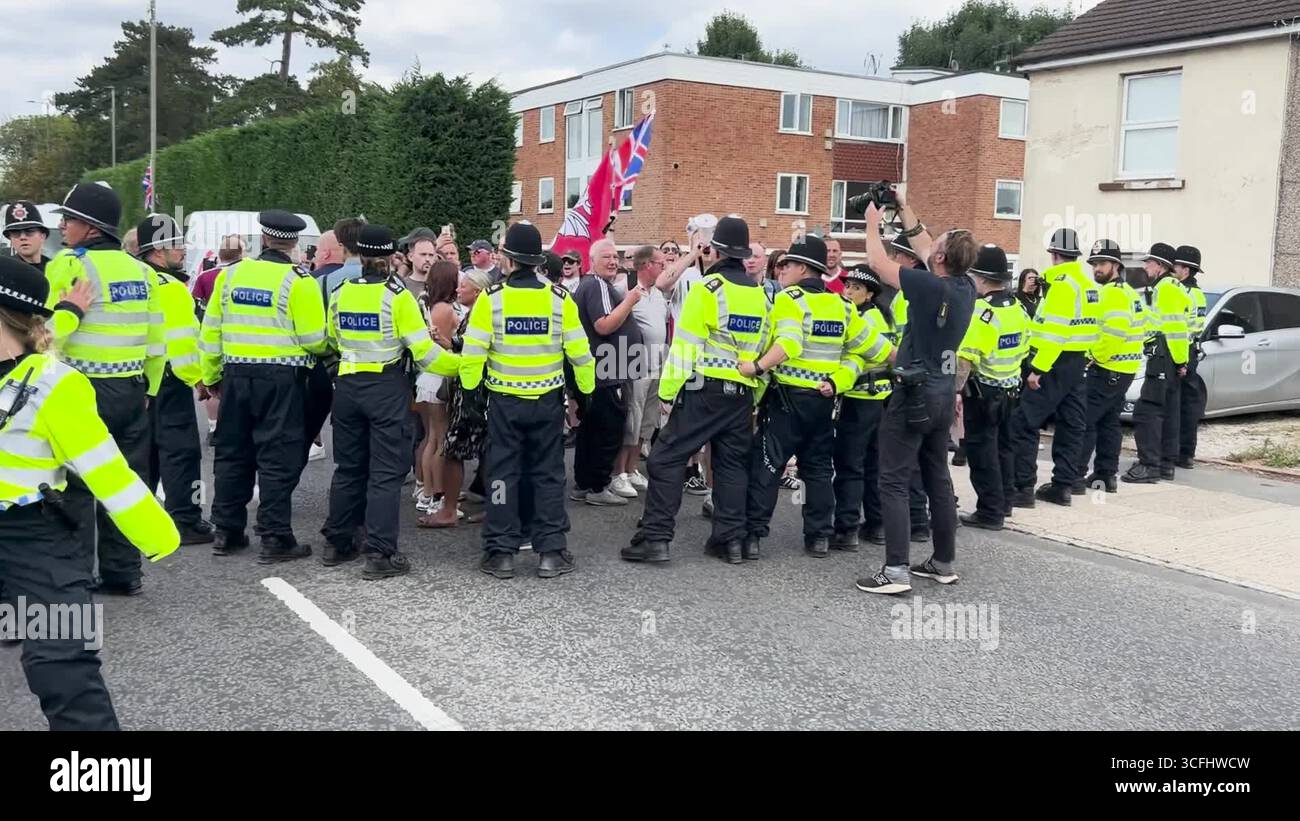 Protesters face off outside Horley hotel Stock Video Footage - Alamy