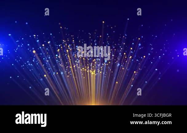 Light burst of blue and gold particles in space Stock Video Footage - Alamy