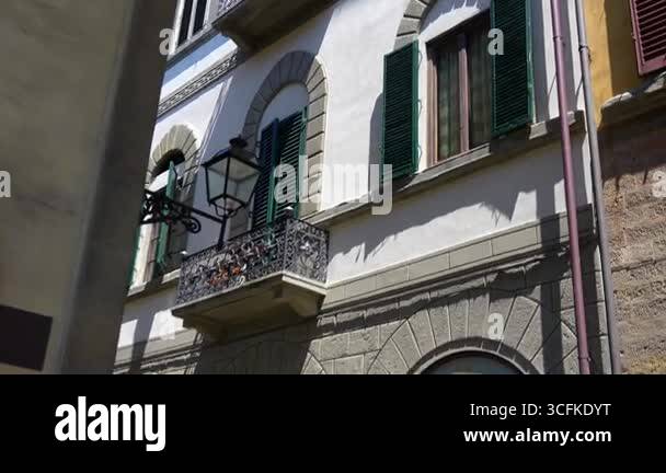 Traditional Florence Building with Green Shutters and Iron Balcony ...