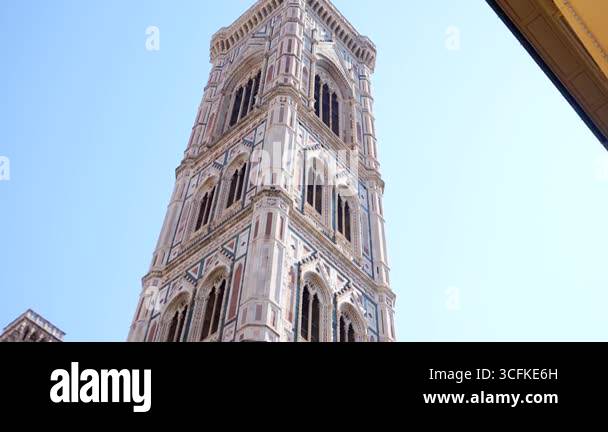 Close up of Giottos Campanile and Florence Cathedral dome with marble ...