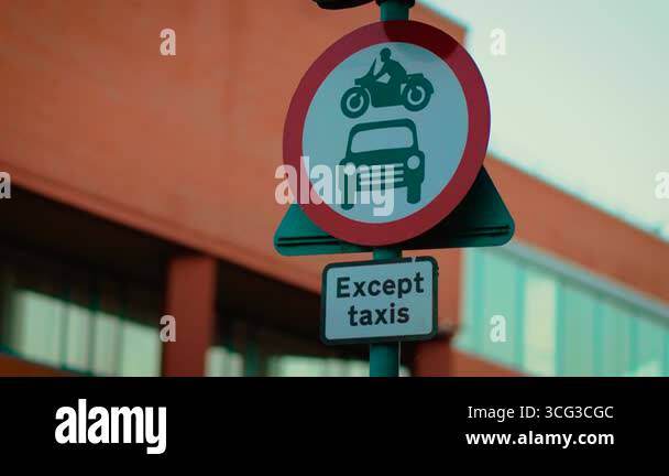 Sign showing no entry for cars and motorcycles standing near modern ...