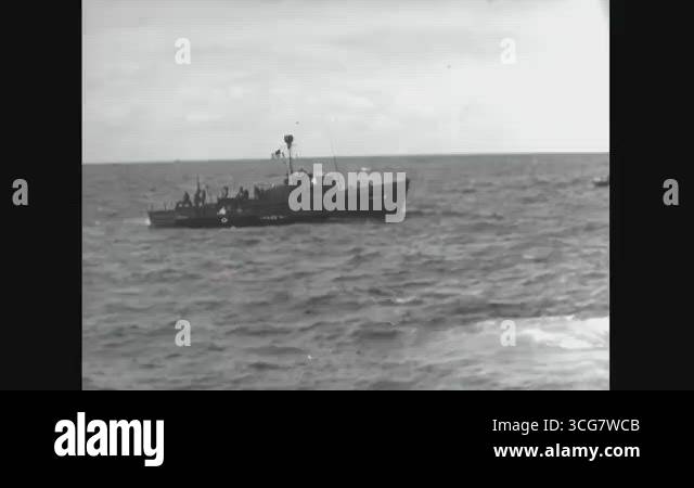NORMANDY - 1944 - Patrol and transport ships sail off the Normandy ...