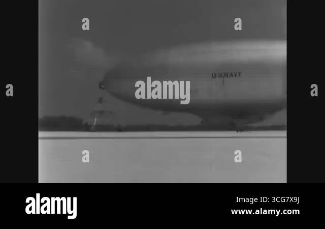 KEY WEST - 1954 - The skipper of the ZPG airship climbs down ladder ...