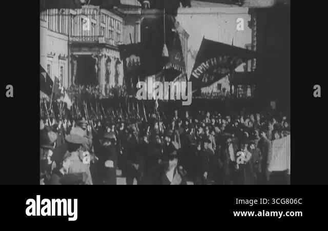 PETROGRAD - 1910s - Men carrying banners and weapons march on the ...