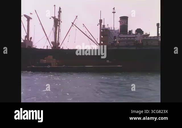 DA NANG - 1966 - A barge alongside the starboard side of a merchant ...