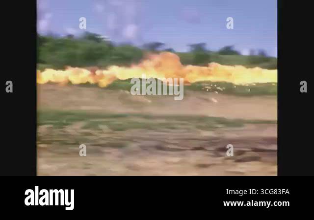 VIEQUES - 1952 - A flame tank fires short bursts of napalm across the ...