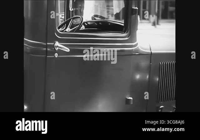 UNITED STATES - 1932 - A station attendant speaks to the driver before ...