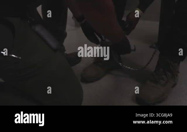 Leg cuffs Stock Videos & Footage - HD and 4K Video Clips - Alamy
