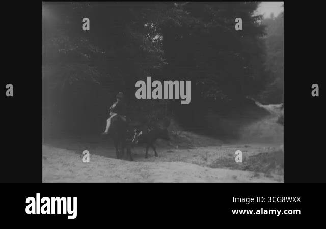 US - 1931 - in this silent documentary, a man and child ride into town ...