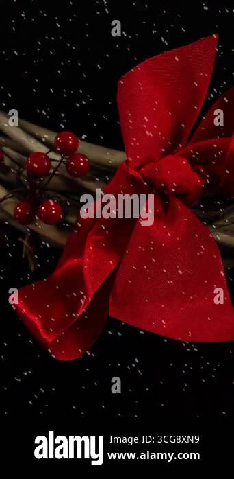 Animation of christmas decoration with red ribbon and snow falling ...