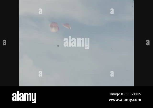 PACIFIC OCEAN - 1970 - The Apollo 13 space capsule parachutes down into ...