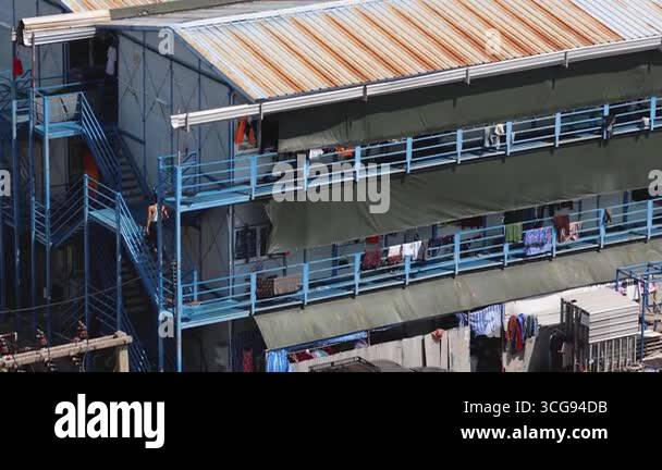 Workers and materials move in a building under construction Stock Video ...
