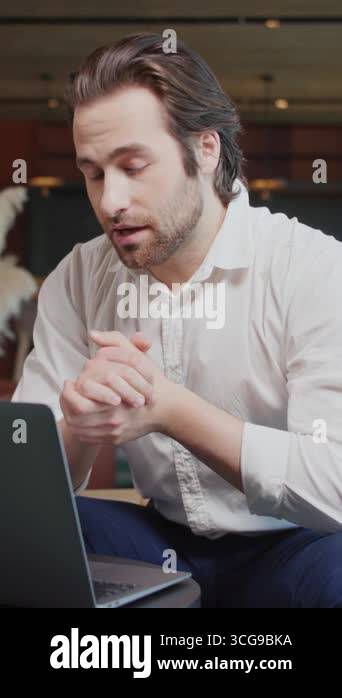 Portrait attractive young business man talking in video conference ...