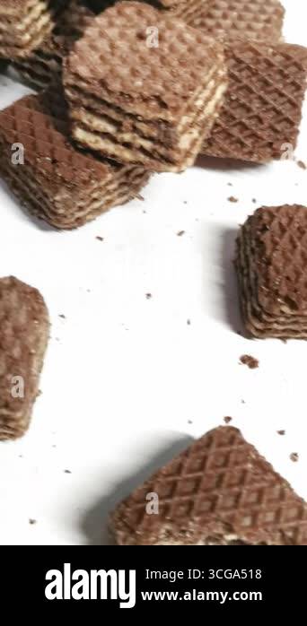 This close-up showcases a variety of miniature, stacked, chocolate ...