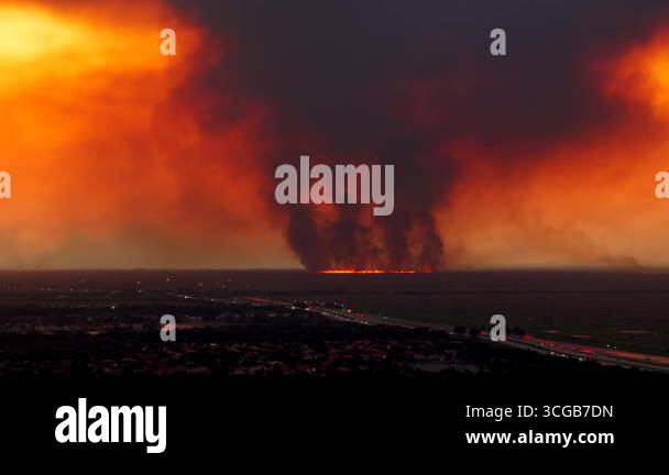 Aerial news video Florida Everglades on fire wildfire at sunset Stock ...