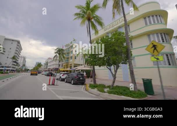 Car driving around Ocean Drive in Miami Beach touristic area on ...