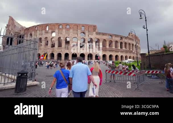 Rome, JULY 31st, 2025 Colosseum exterior with visitors gathering in the ...