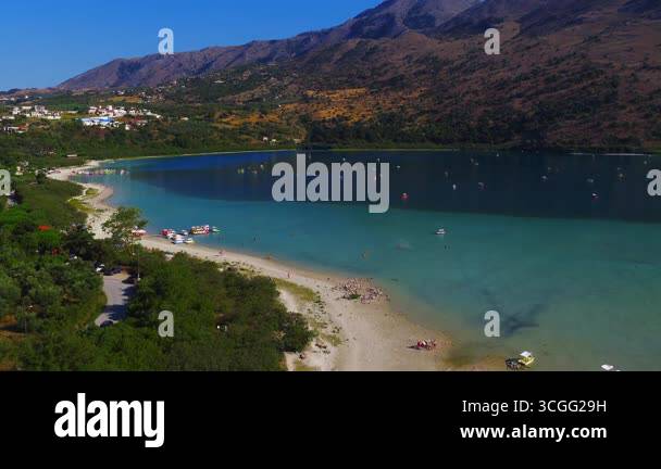 Aerial view of Lake Kournas in Crete with blue waters, paddle boats ...
