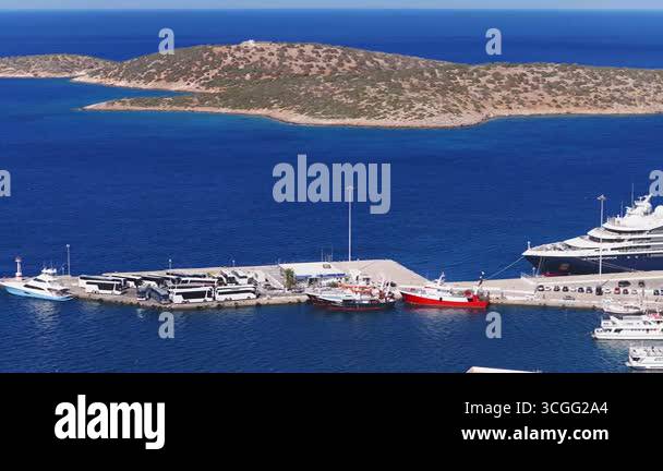 Aerial view of Agios Nikolaos, Crete, showing a harbor with a cruise ...