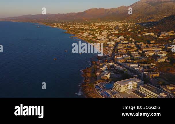 A sweeping aerial view of Stalida, Crete, showing sandy beaches, calm ...