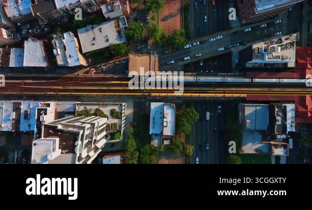 Train moves by the railways. Multiple cars ride by the highway and ...
