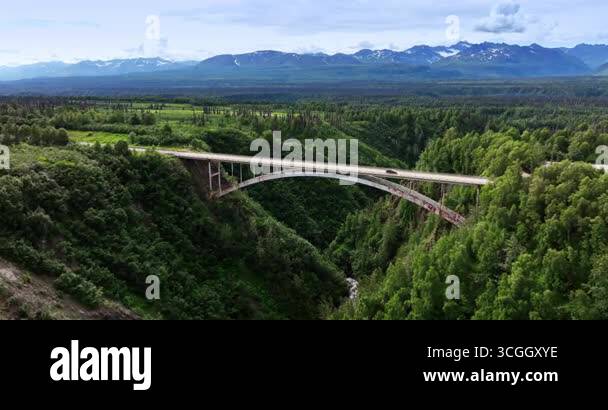 Connecting with Alaska beauty. A stunning view of a tall bridge ...