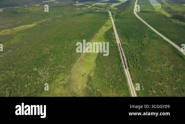 Exploring the vast landscapes of Alaska. Endless greenery and winding ...