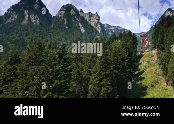 Scenic cable car ride through mountains. Enjoying a cable car journey ...