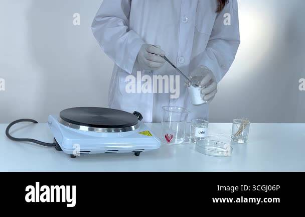 Demonstrating sodium acetate crystallization in a lab setting Stock ...