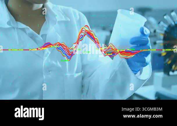 Laboratory scientist reaching for beaker and lifting orange liquid as waveform displaying ...