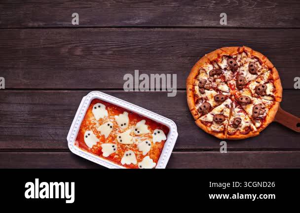 Spooky Halloween dinner party table setting stop motion video. Top view ...