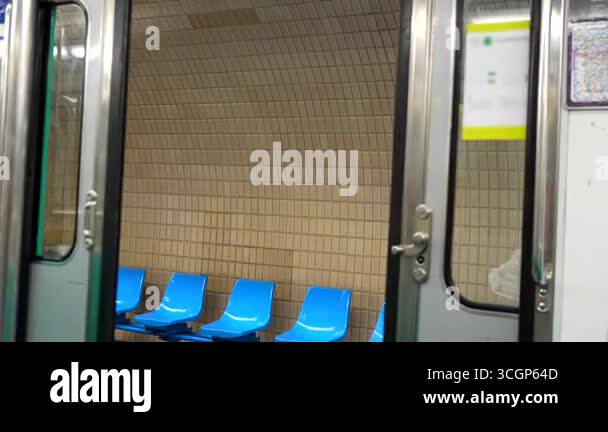Automatic metro train doors closing at underground station interior ...