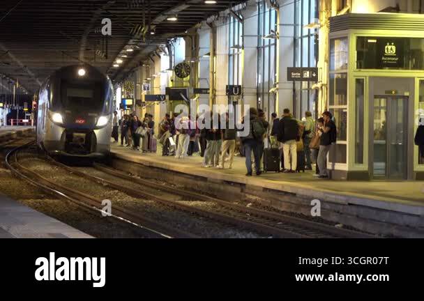 Cannes, France - July 2, 2025: Busy railway station platform with a ...