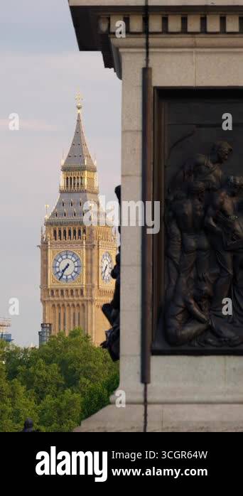 Close-up view of the Big Ben clock tower illuminated by golden sunlight ...